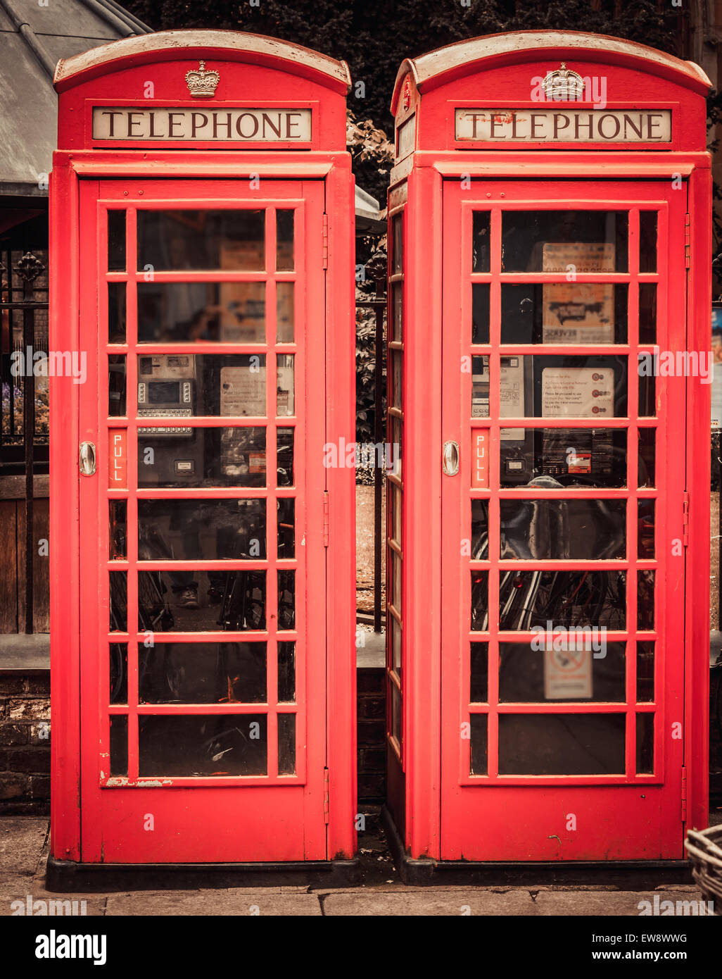 British twin Red Telephone boxes retro filter applied Stock Photo - Alamy