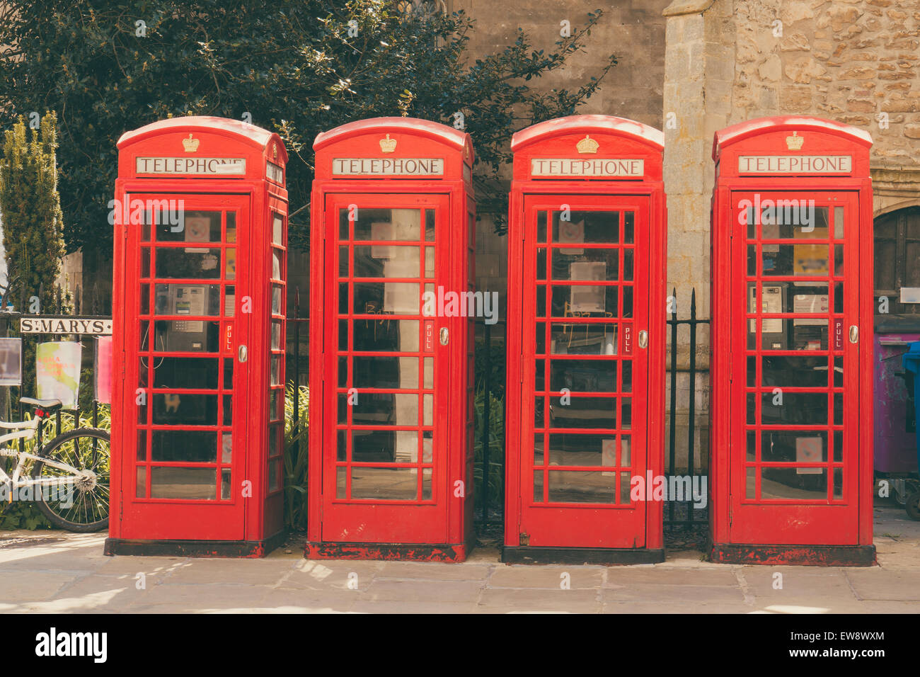 Row of beautiful British red Telephone boxes retro look Stock Photo - Alamy
