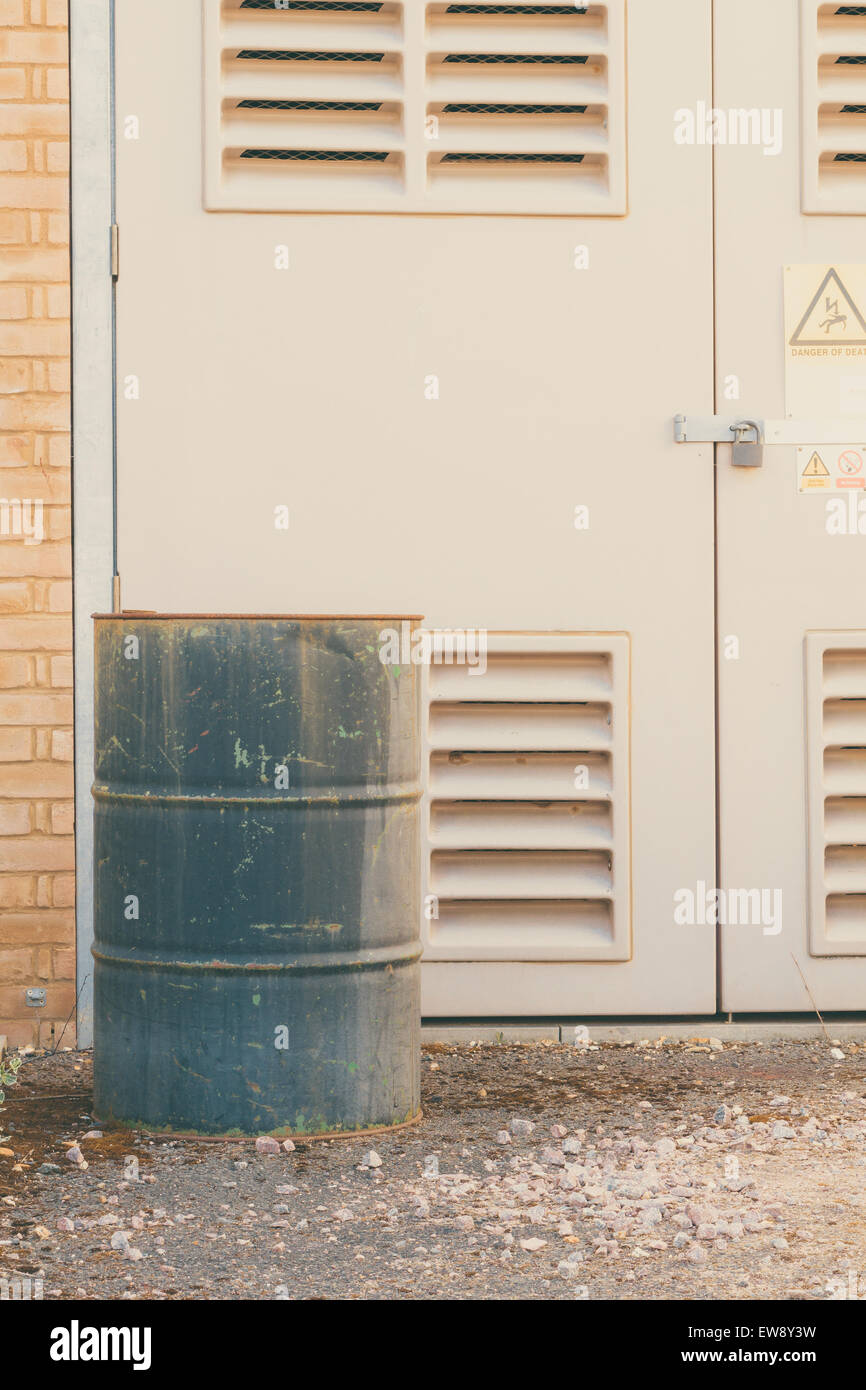 Black rustic metal container drum vertical image Stock Photo - Alamy