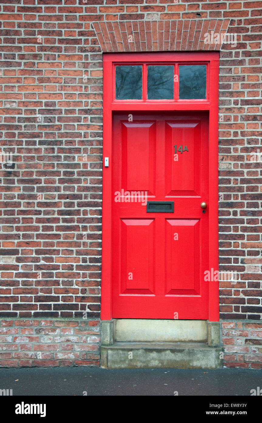 Brightly painted red door on a street in Newark on Trent ...
