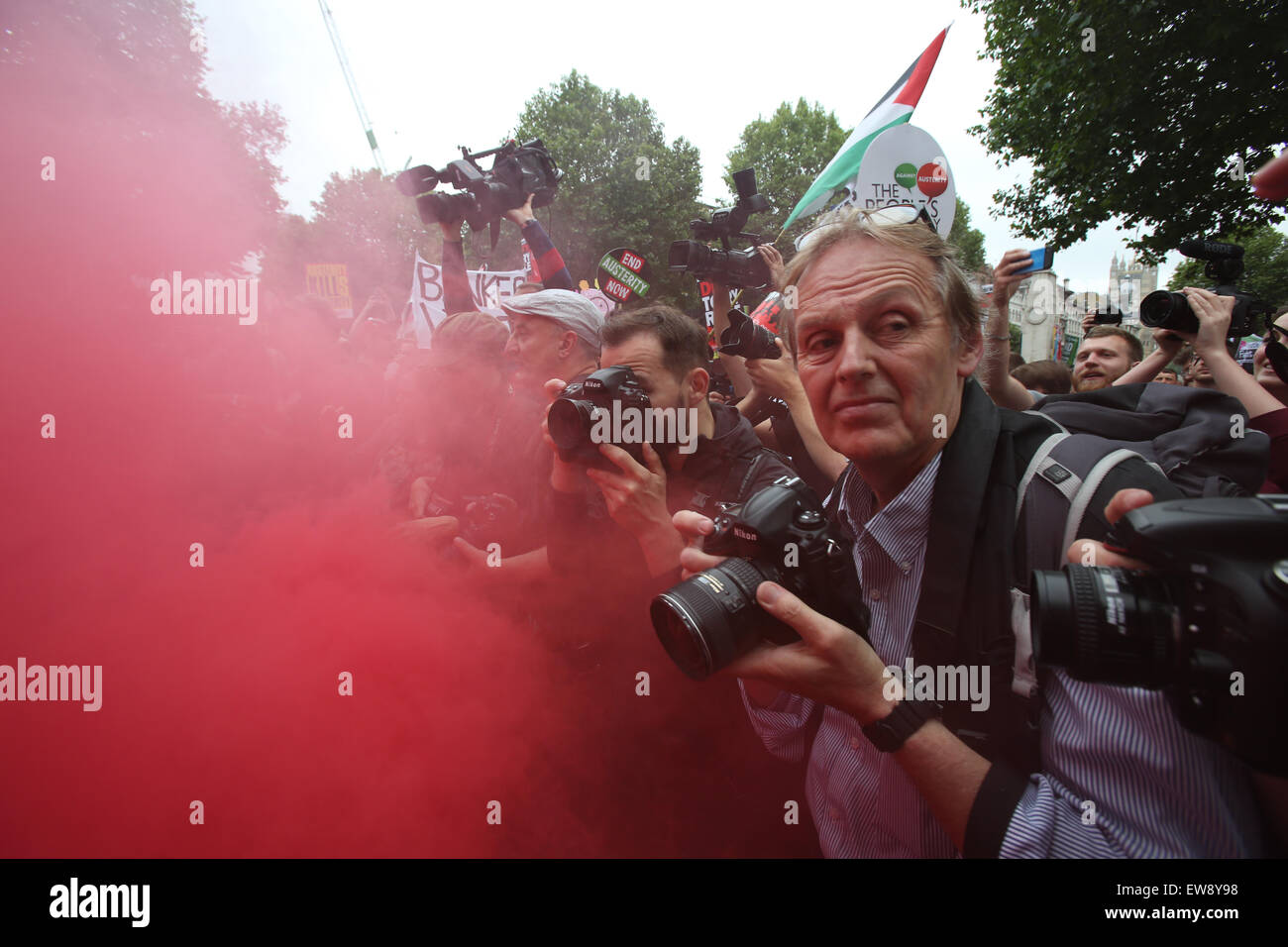 London, UK. 20th June, 2015. Photographer amid a crowd surrounding a ...