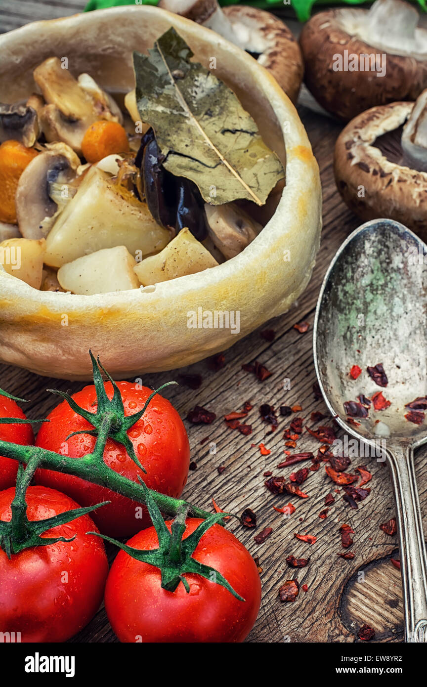 vegetable hot plate made of baked dough on wooden countertop.Photo ...