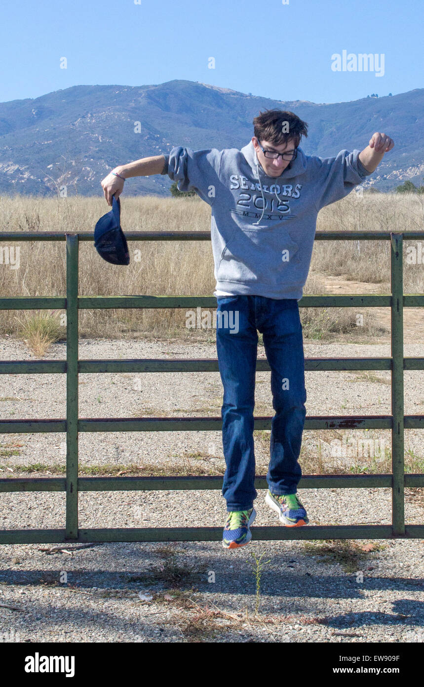 Climbing a fence hi-res stock photography and images - Alamy