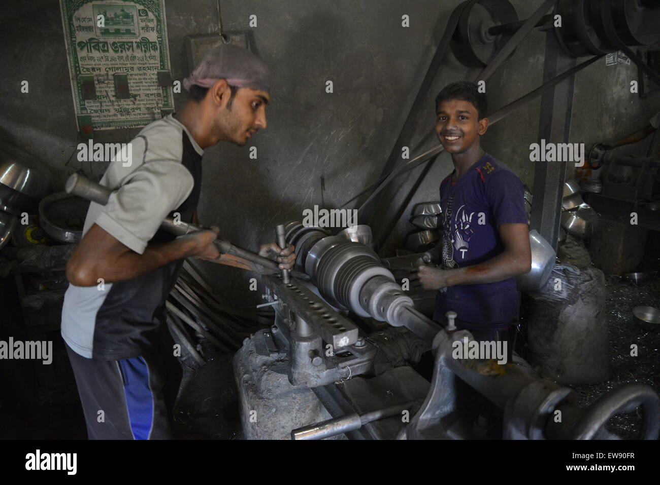 Bangladeshi manual labors works in an aluminum pot-making factory, each ...