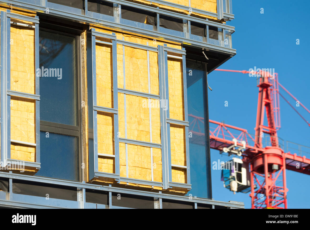 Thermal insulation fixed to the facade of a building under construction ...