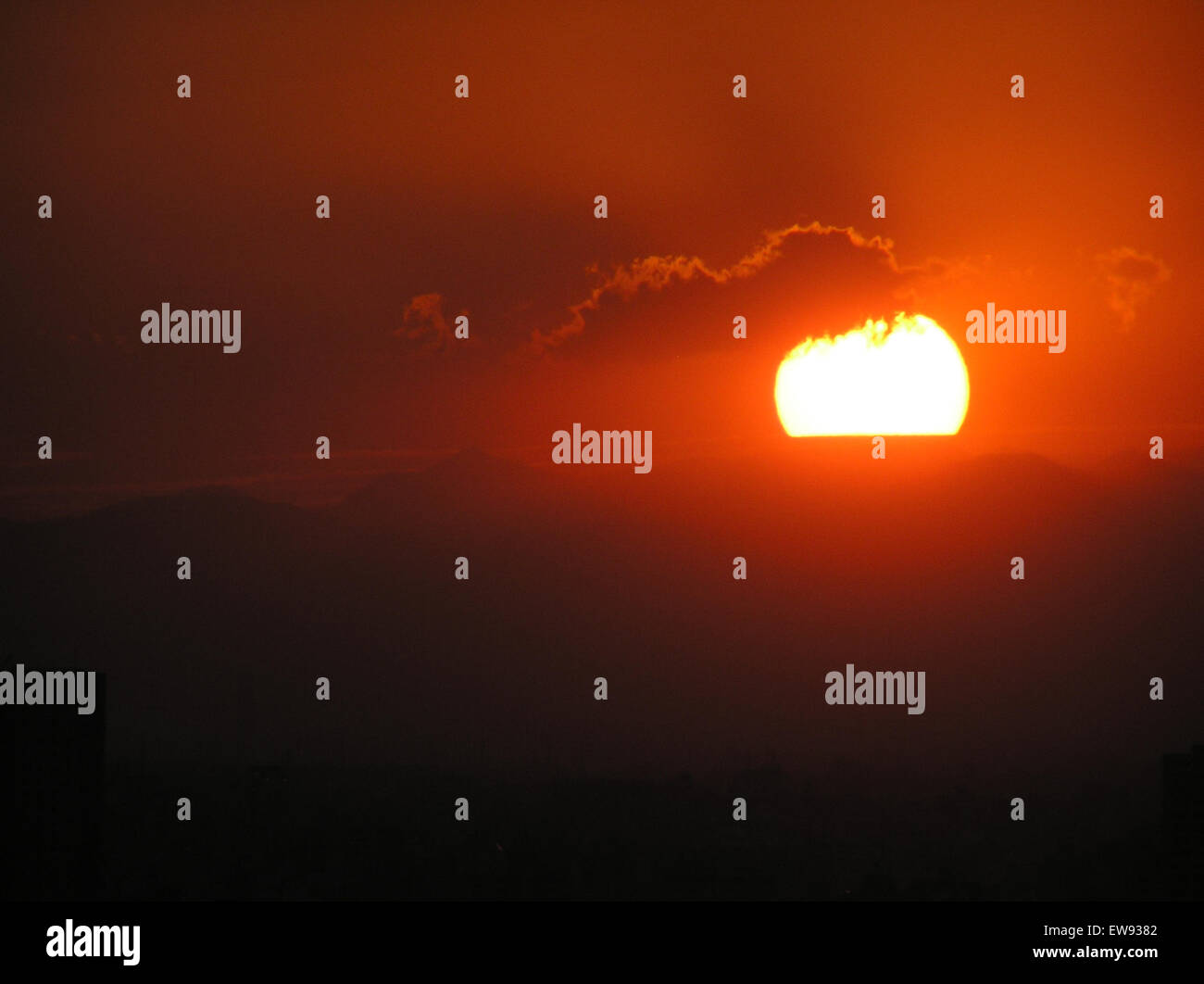 A stunning sunset captured on October 2, 2003, in Tokyo, providing a ...