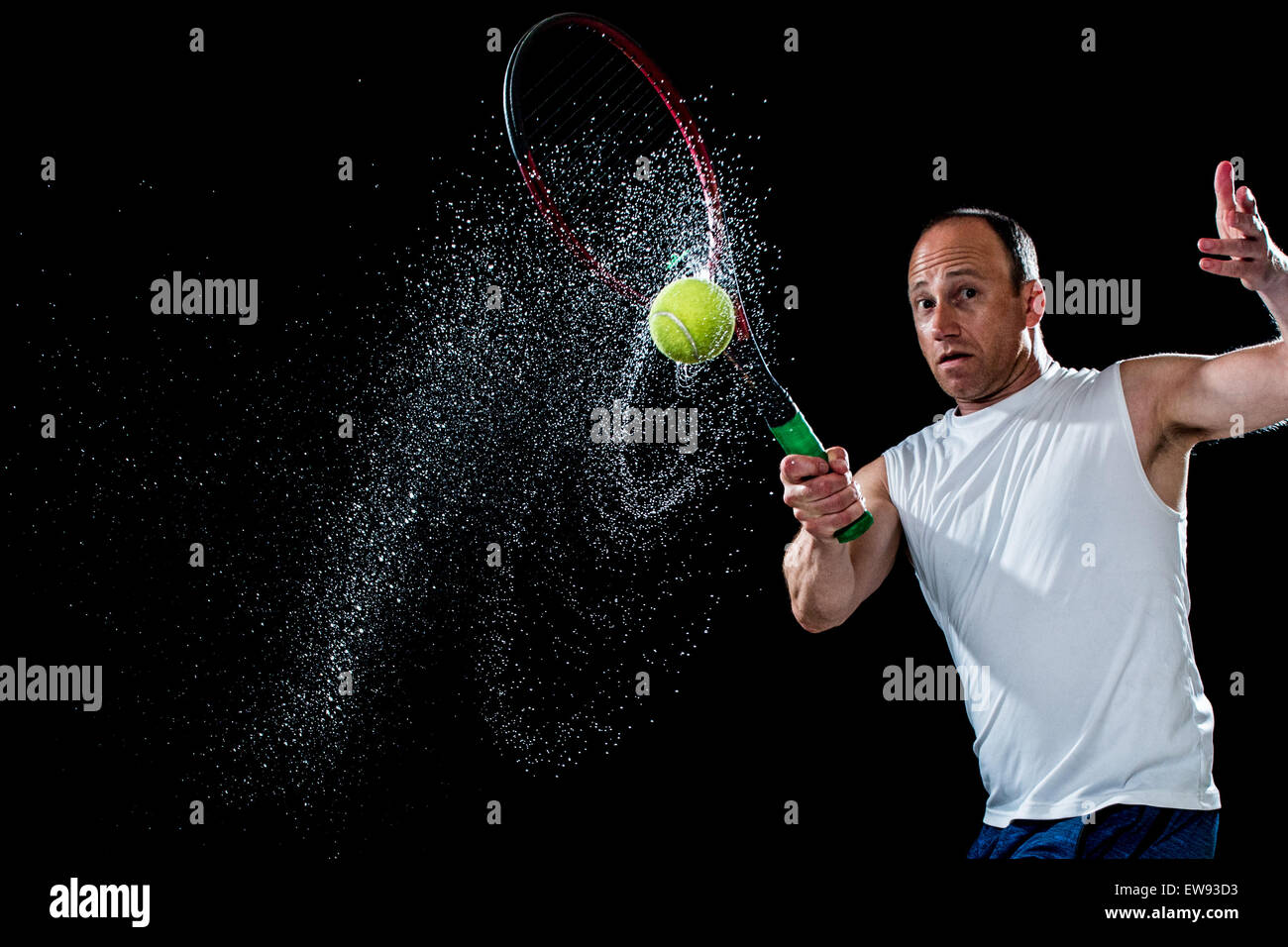 Tennis action shot. Forehand. Studio shot over black Stock Photo - Alamy