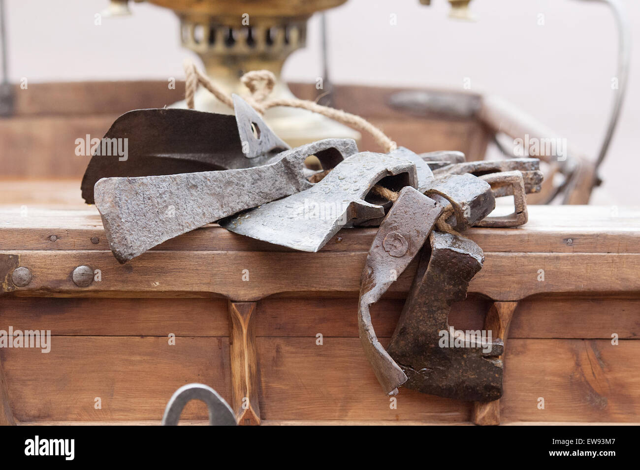 Axes on wooden carriage back Stock Photo - Alamy