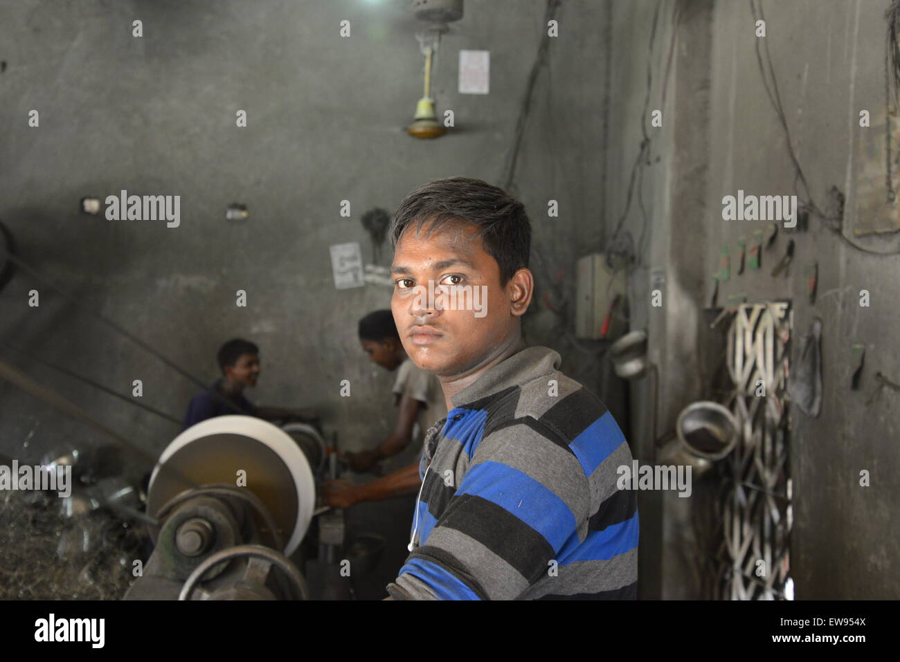 Bangladeshi manual labors works in an aluminum pot-making factory, each ...