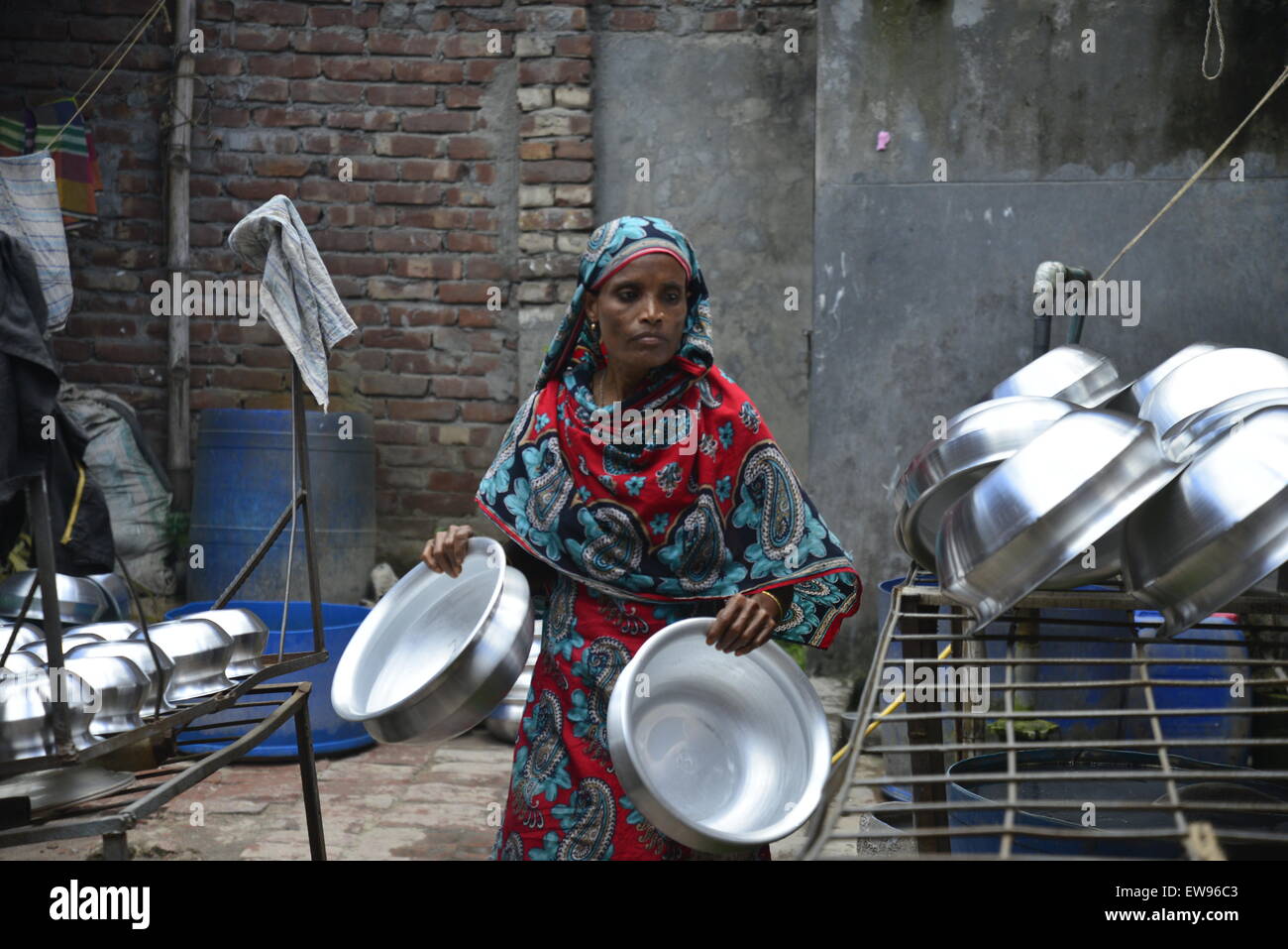 Bangladeshi manual women labors works in an aluminum pot-making factory ...