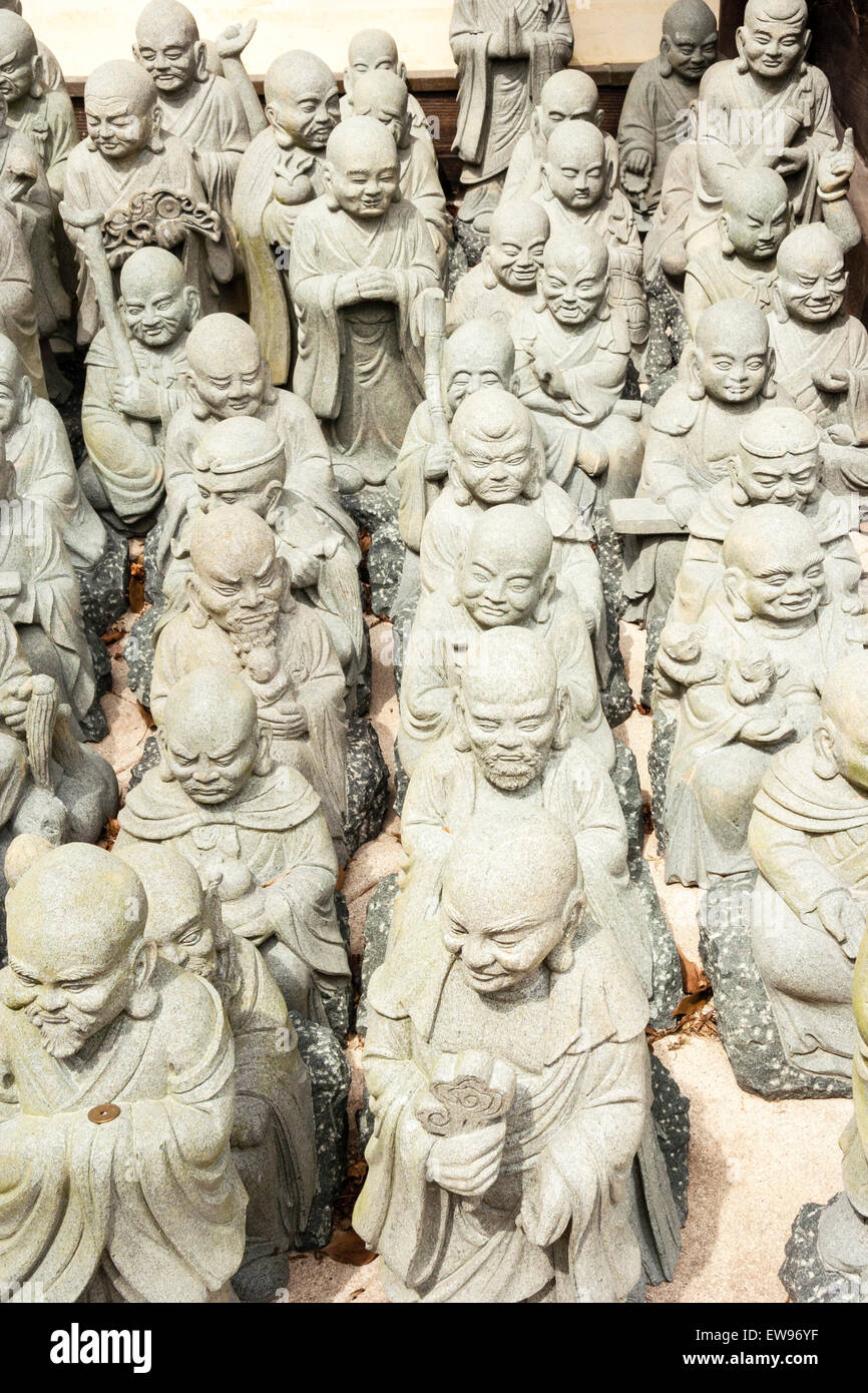 Japan, Miyajima. Small Rakan statues of Buddhist monks, disciples of ...