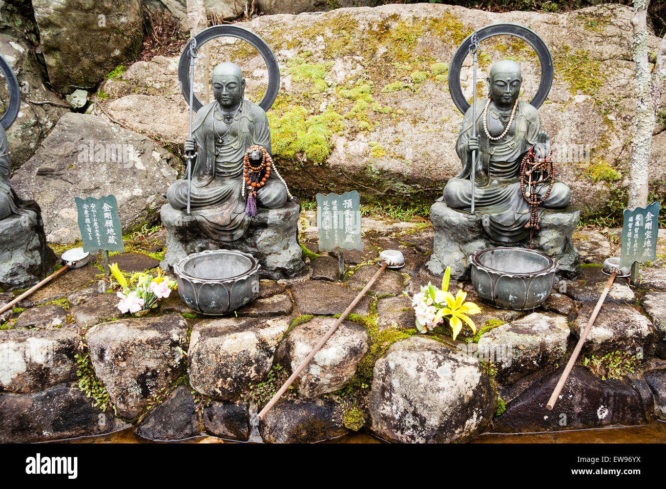 Japan, Miyajima. Daisho-in temple. Two Jizo Bosatsu stone statues of ...