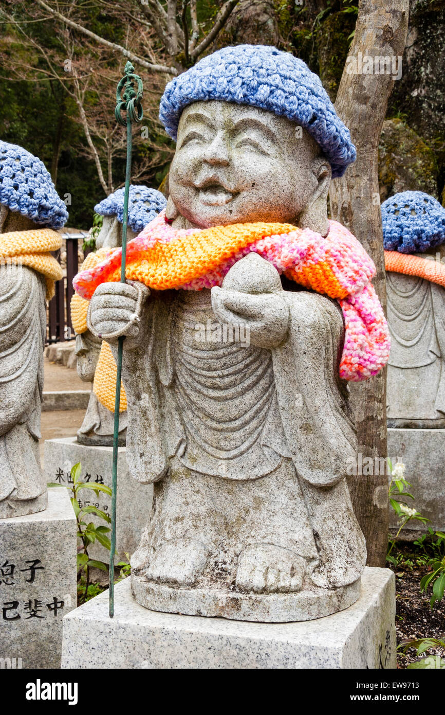Japan, Miyajima. Daisho-in temple. Stone Jizo bosastu statue of ...
