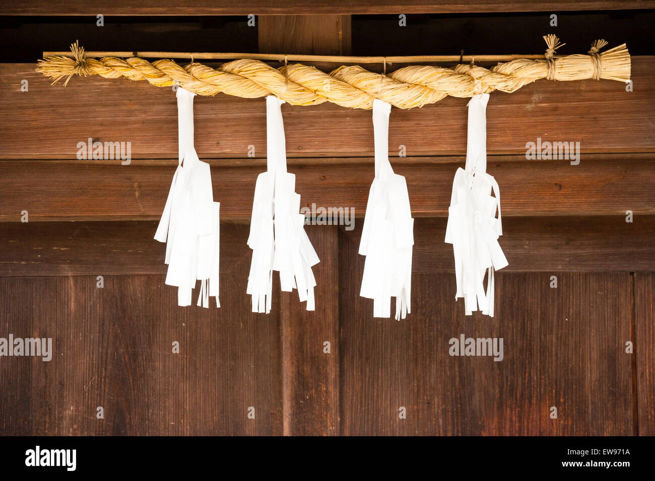 Japanese Shinto shrine detail. Wooden door with shimenawa straw rope ...