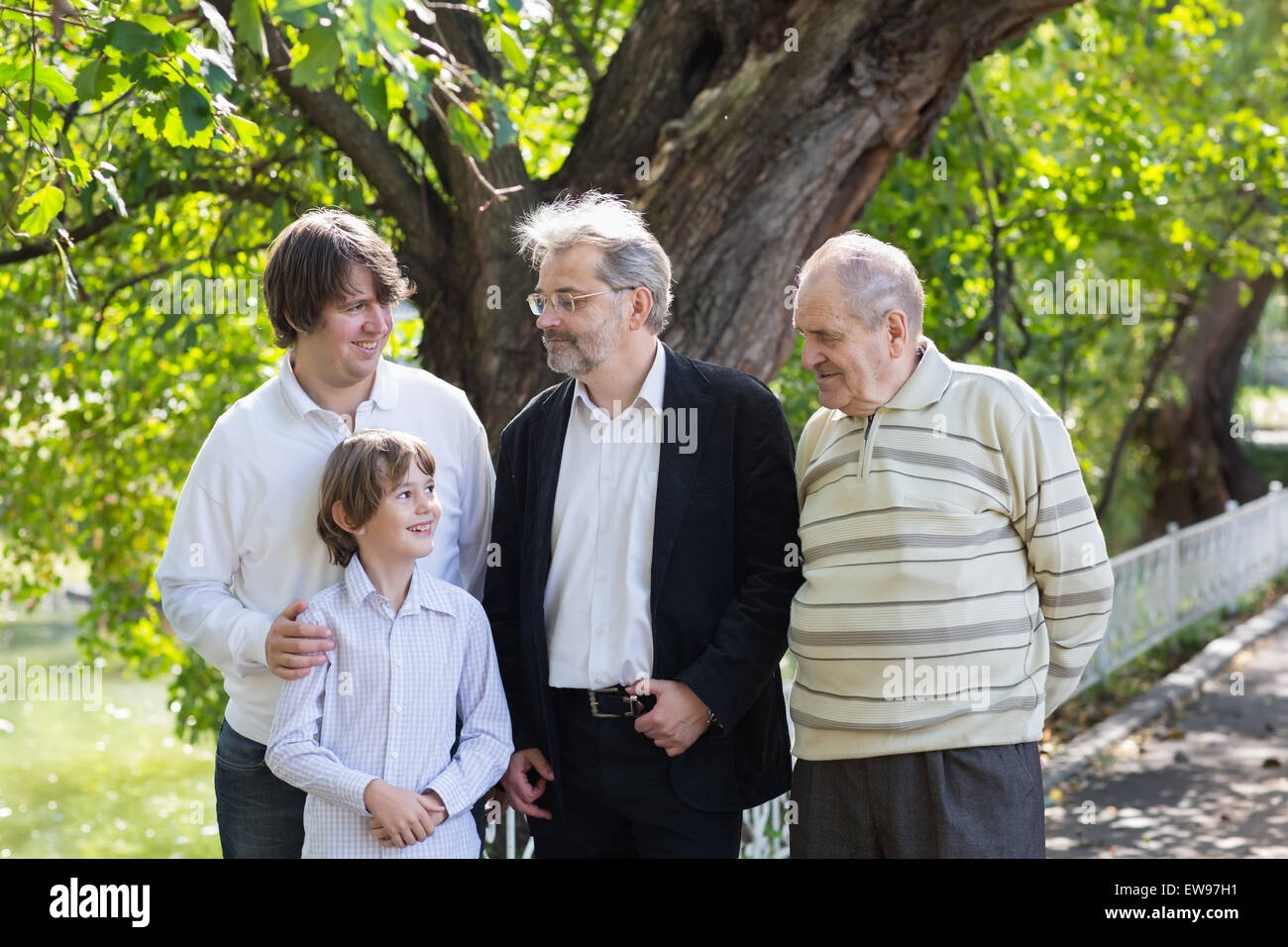 Four generations of men in a park Stock Photo - Alamy
