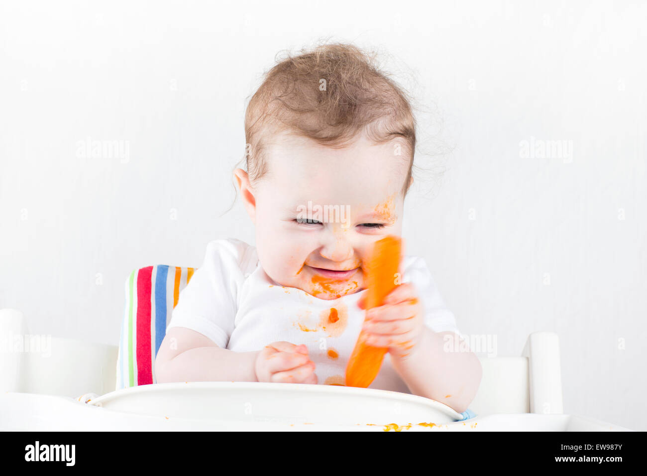 Funny little baby trying vegetable for the first time in her life Stock ...