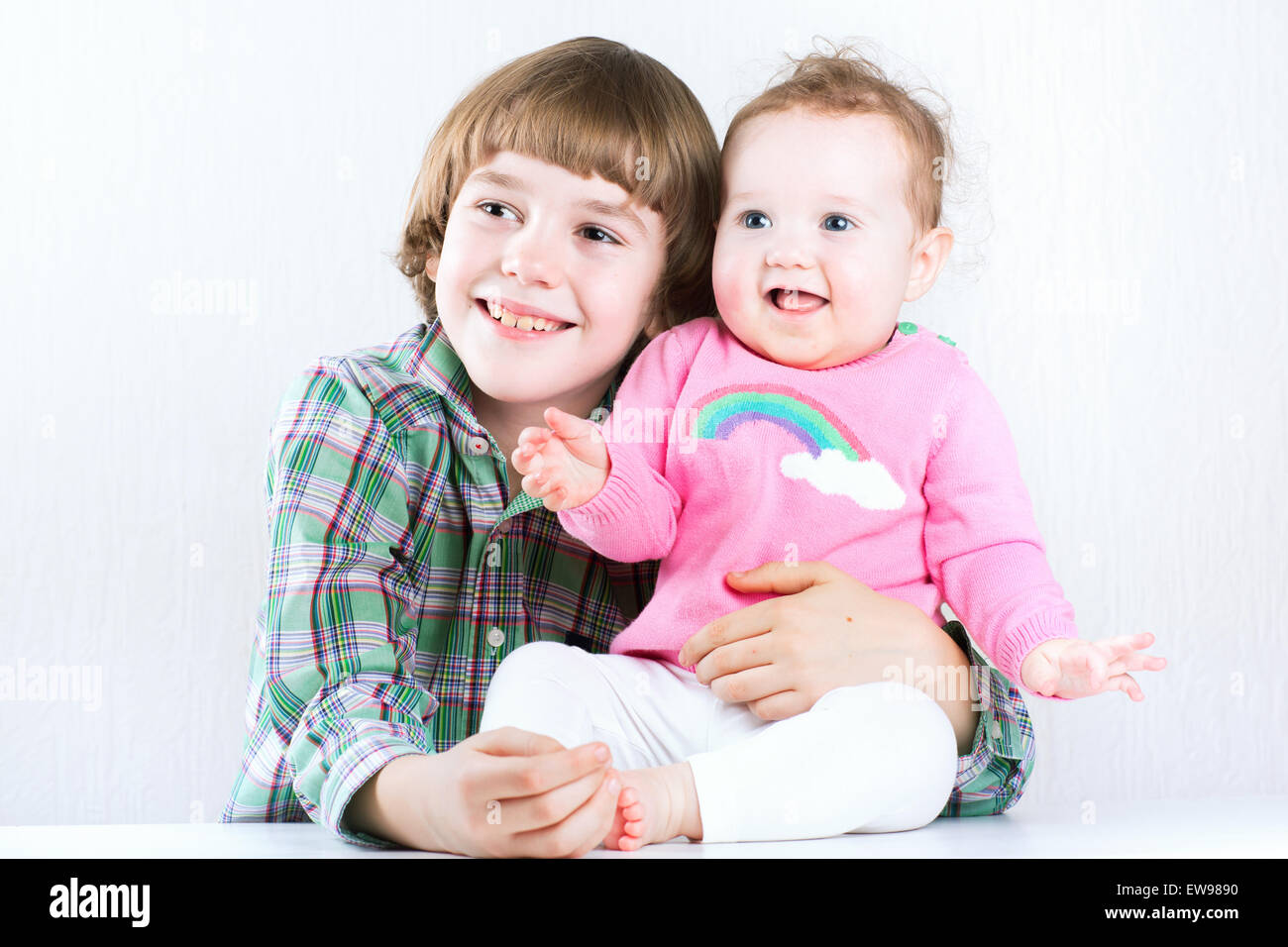 Two happy siblings playing together Stock Photo - Alamy