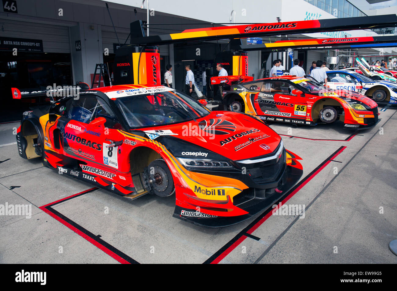 A photograph of the ARTA Honda NSX GT500 and the ARTA Honda CR-Z GT300 during the 2014 Super GT ...