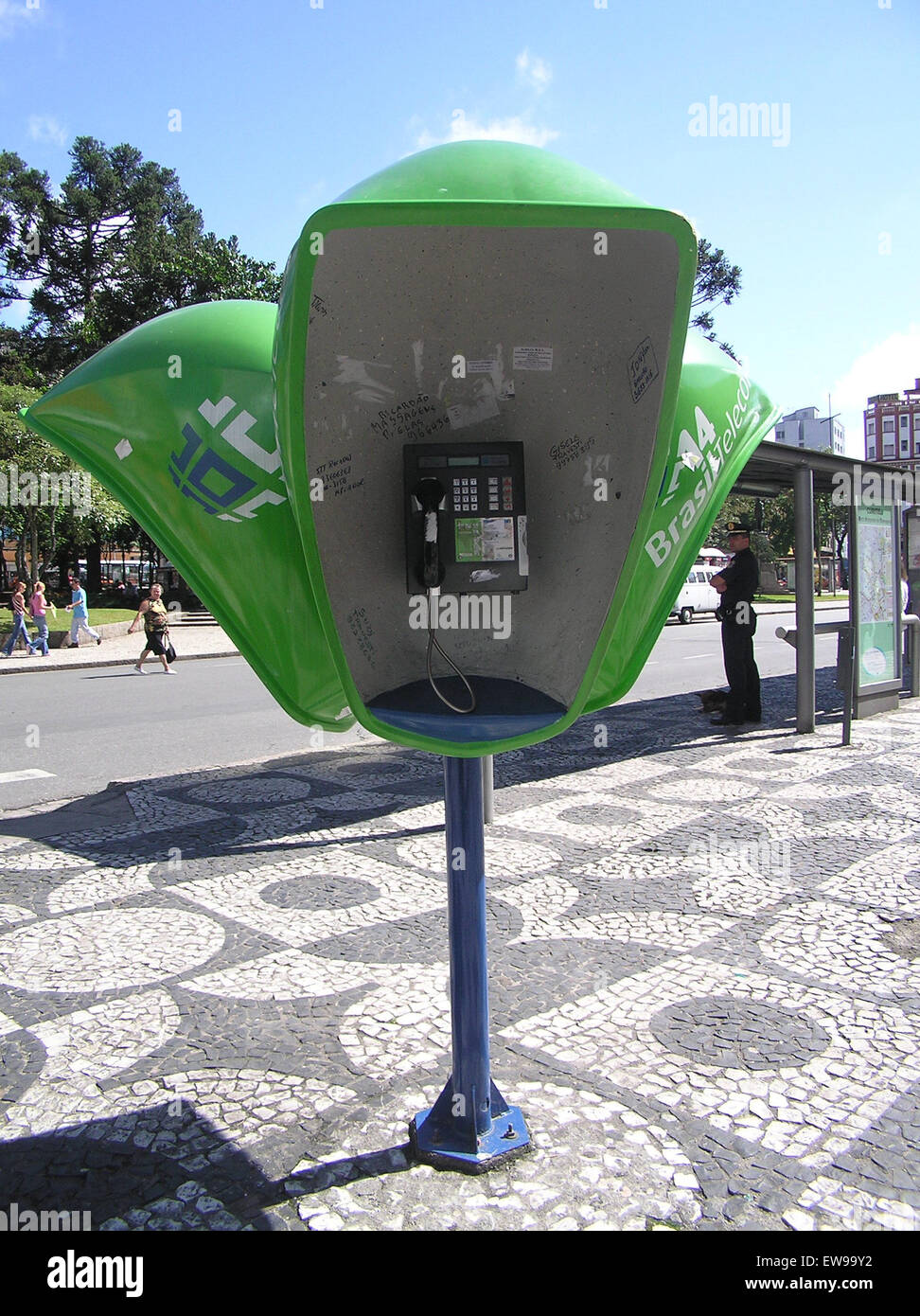 This image captures a telephone booth in Curitiba, Brazil, reflecting ...