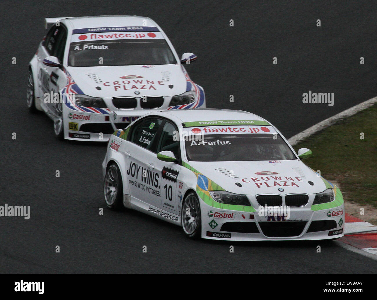 This photograph captures Augusto Farfus slipstreaming Andy Priaulx ...