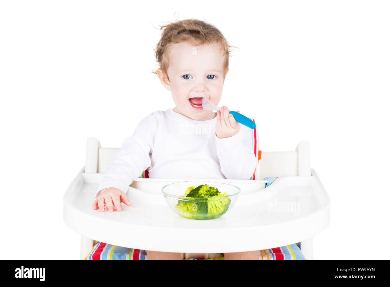 Cute little baby eating broccoli, isolated on white Stock Photo - Alamy