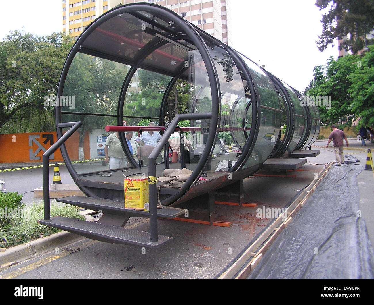 This image features a modern bus stop in Curitiba, Brazil, part of a ...