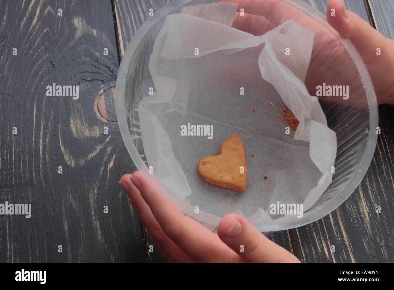 in the hands of the last cookie in the box Stock Photo - Alamy