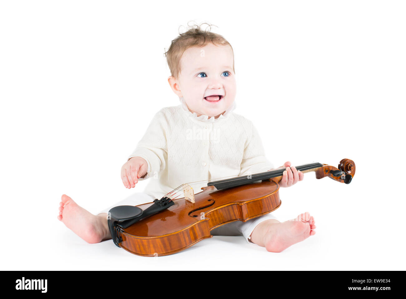Beautiful baby girl playing with a violin Stock Photo - Alamy