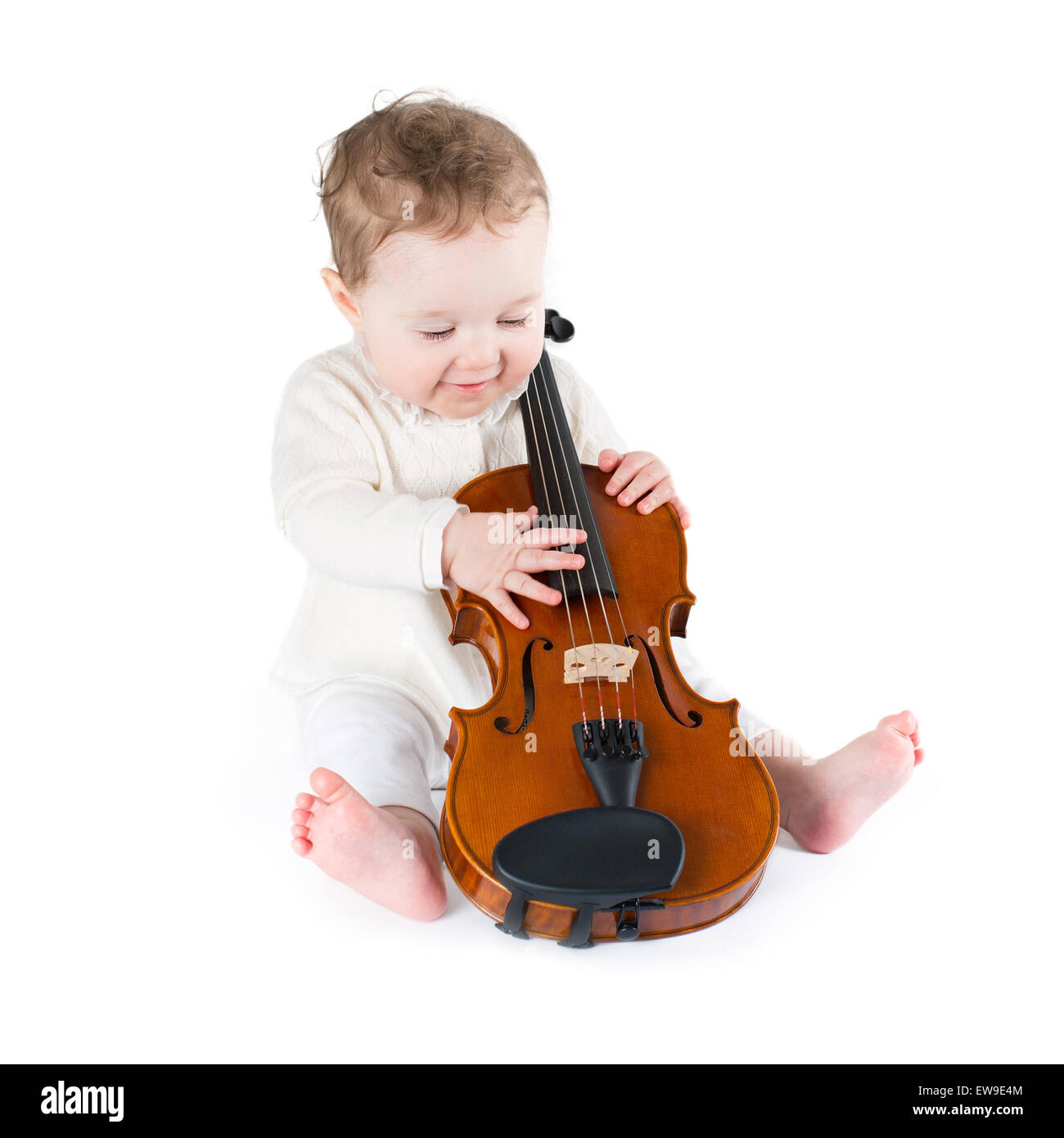 Beautiful baby girl playing with a violin Stock Photo - Alamy