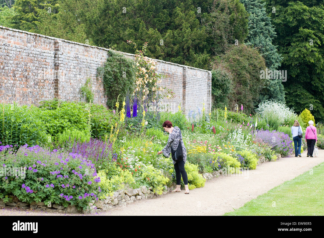 People walking around in the walled Border garden at Waterperry Gardens ...