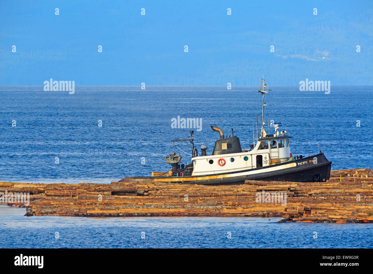Tugboat pushing log boom in Georgia Strait, just north of Nanaimo ...