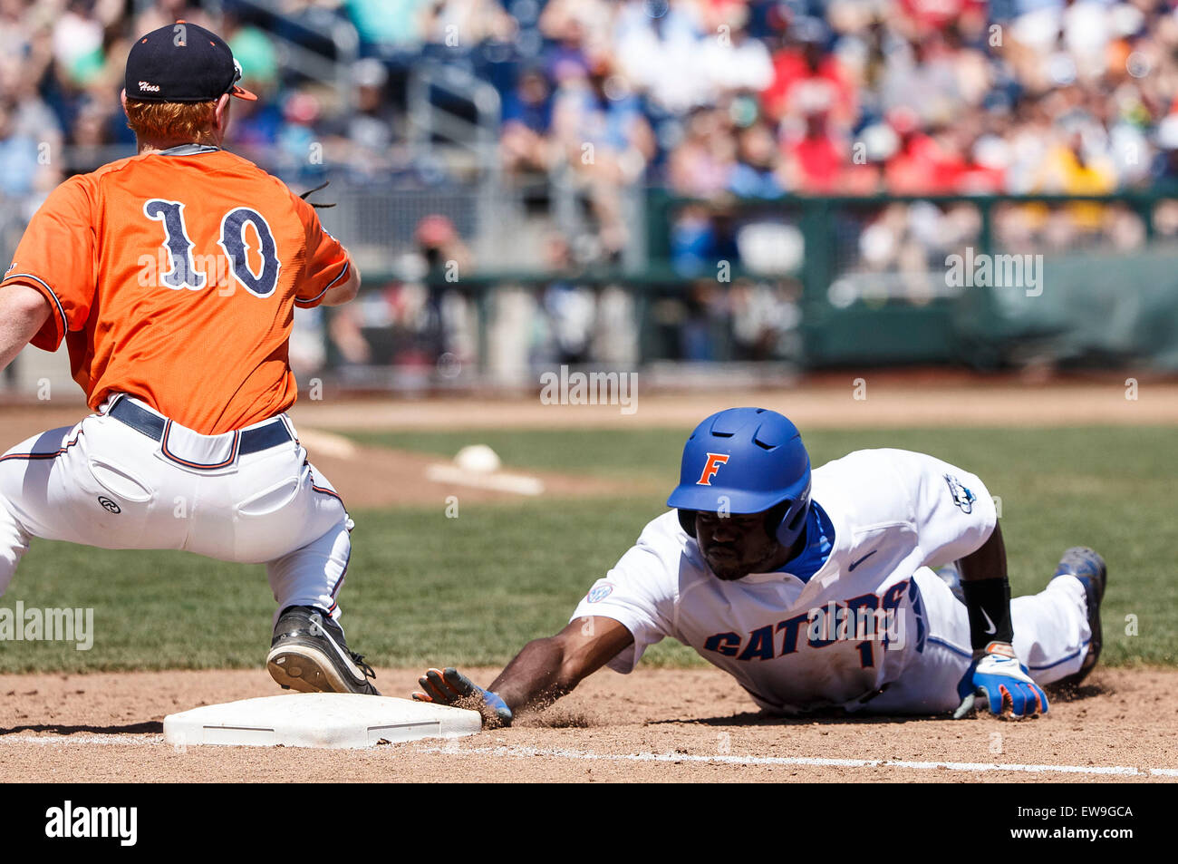 June 19, 2015: Florida's Josh Tobias #11 slides safely back to 1st base ...