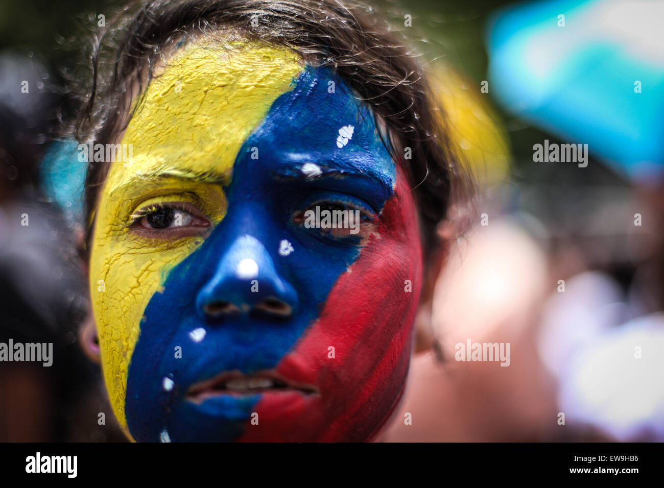 Caracas, Venezuela. 20th June, 2015. A Venezuelan woman with her face ...