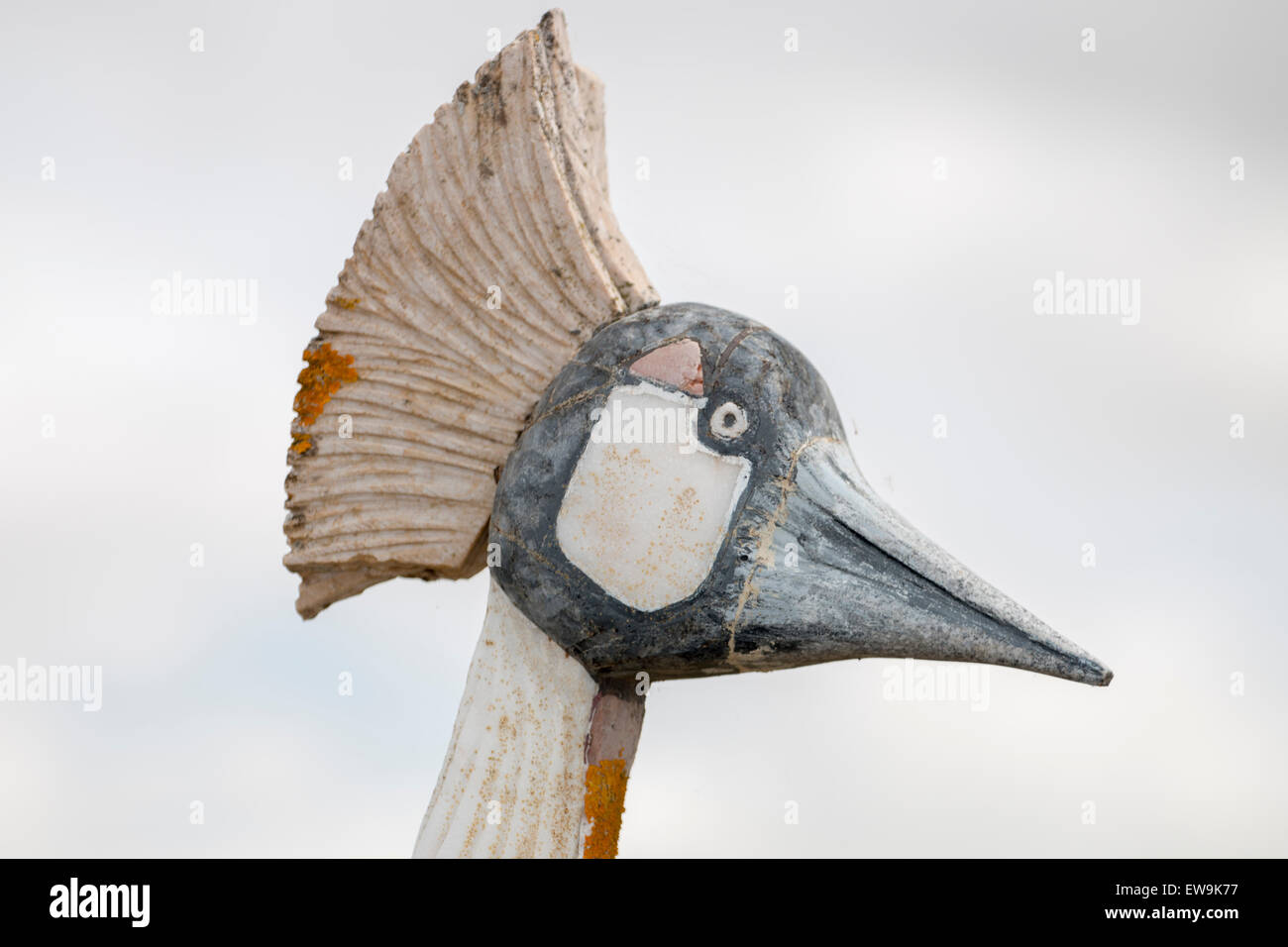 View of a stone statue of grey crowned crane bird Stock Photo - Alamy