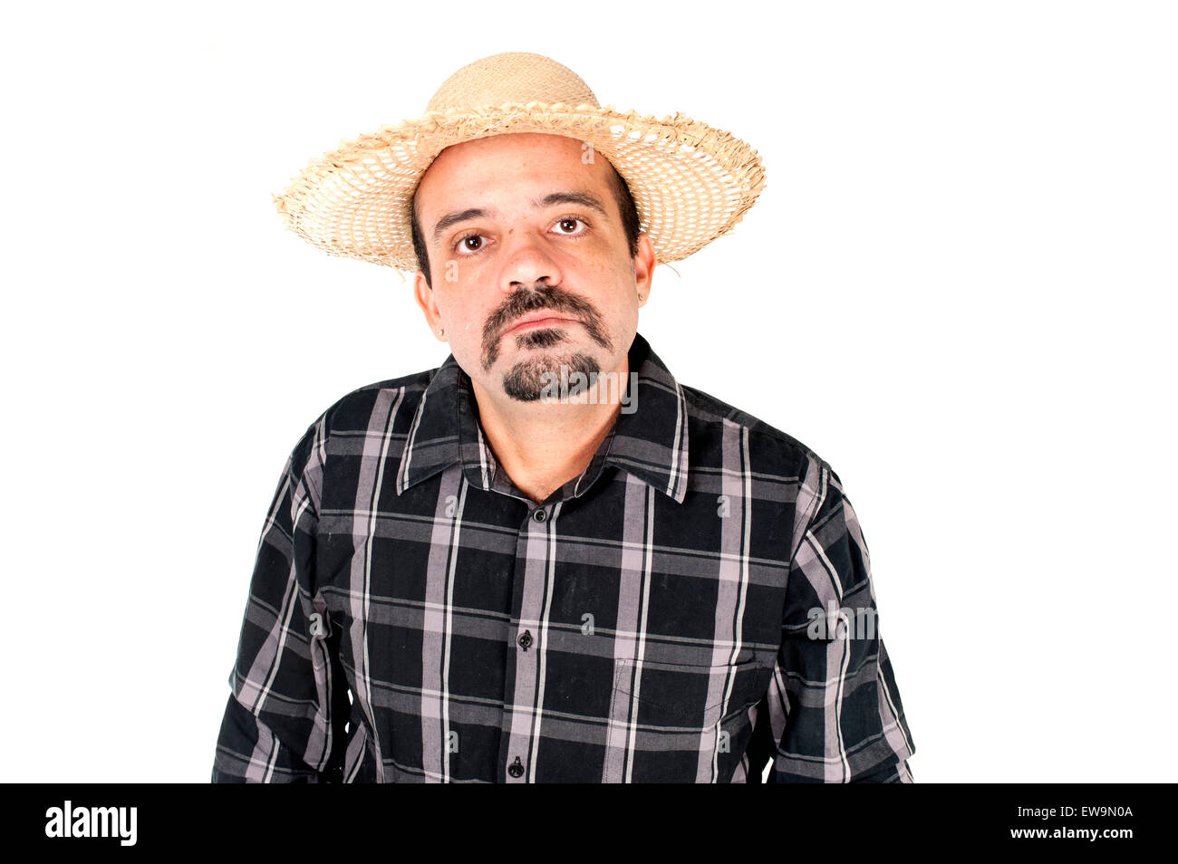 Serious man with a straw hat Stock Photo - Alamy