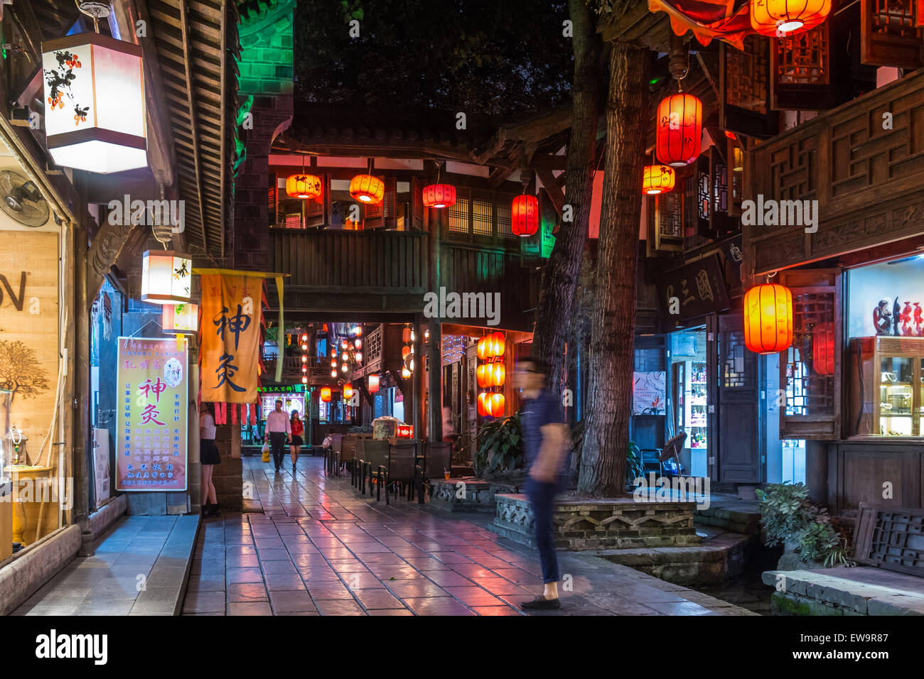 People walking by restaurants at night in Chengdu, China Stock Photo ...