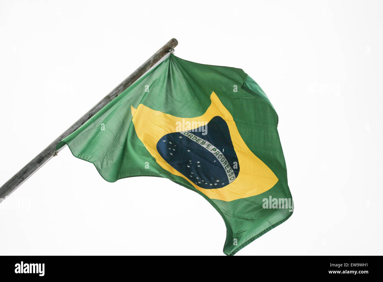 Brazilian flag waving on pole with readable text Stock Photo - Alamy