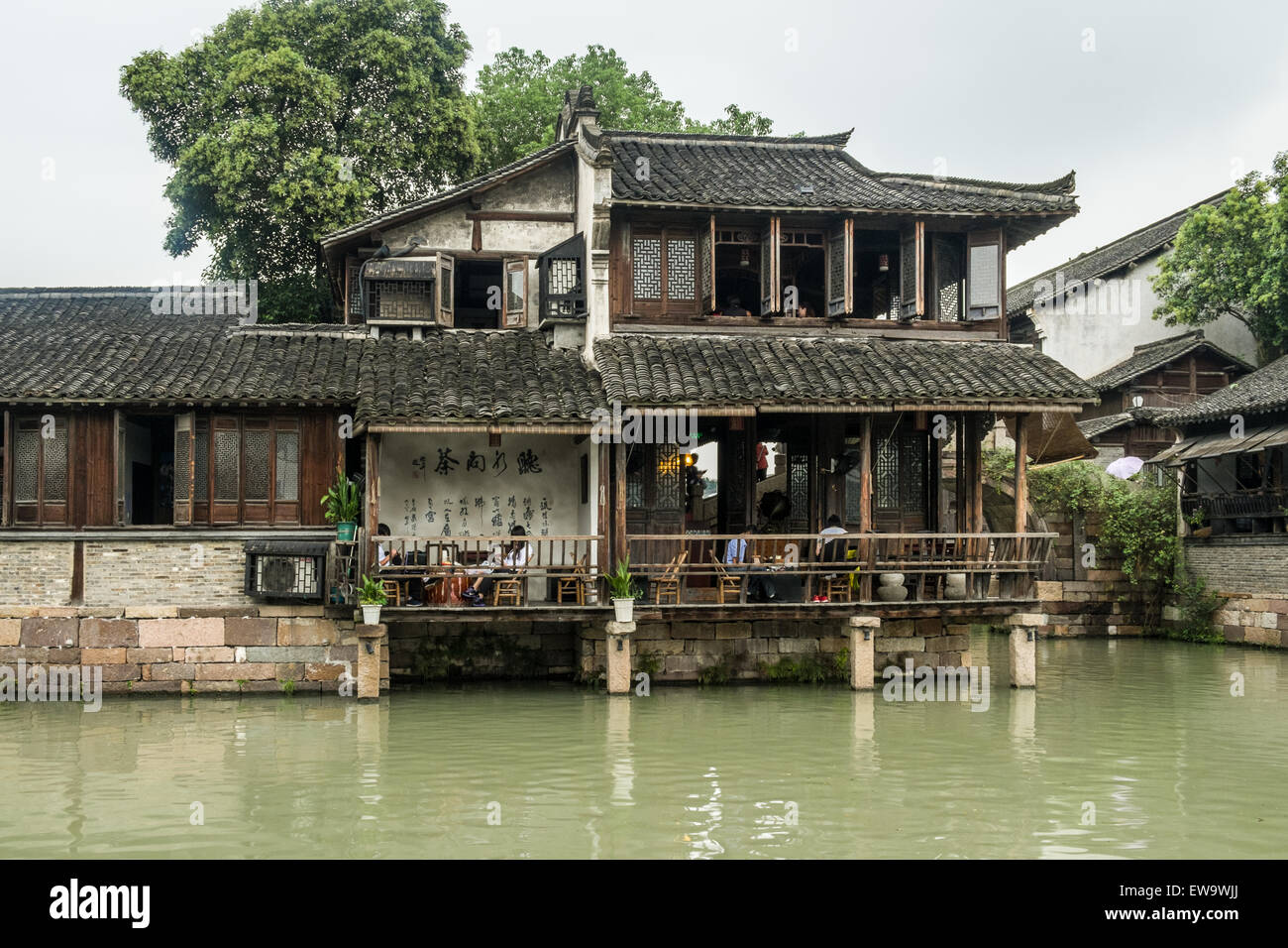 Traditional Chinese restaurant on the corner of a canal in the historic ...