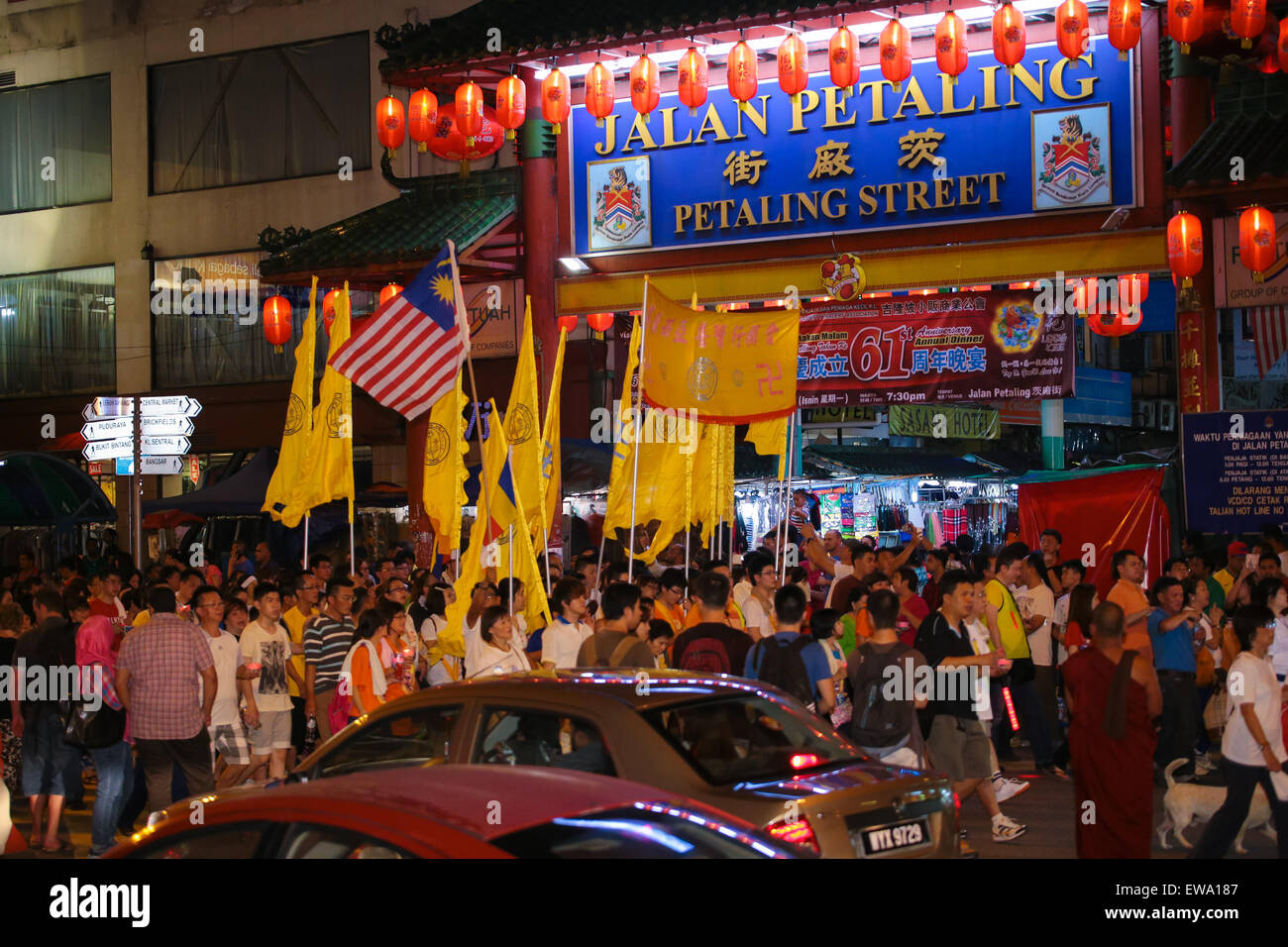 Buddhish devotees carrying flags on Wesak day procession walk pass the ...