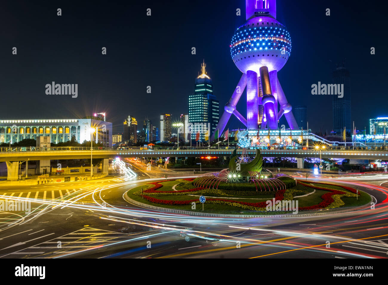 Light trails at night at roundabout with The Oriental Pearl TV Tower in ...