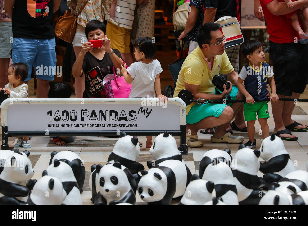 Family taking photo of the mache panda at 1600 Pandas campaign by WWF ...