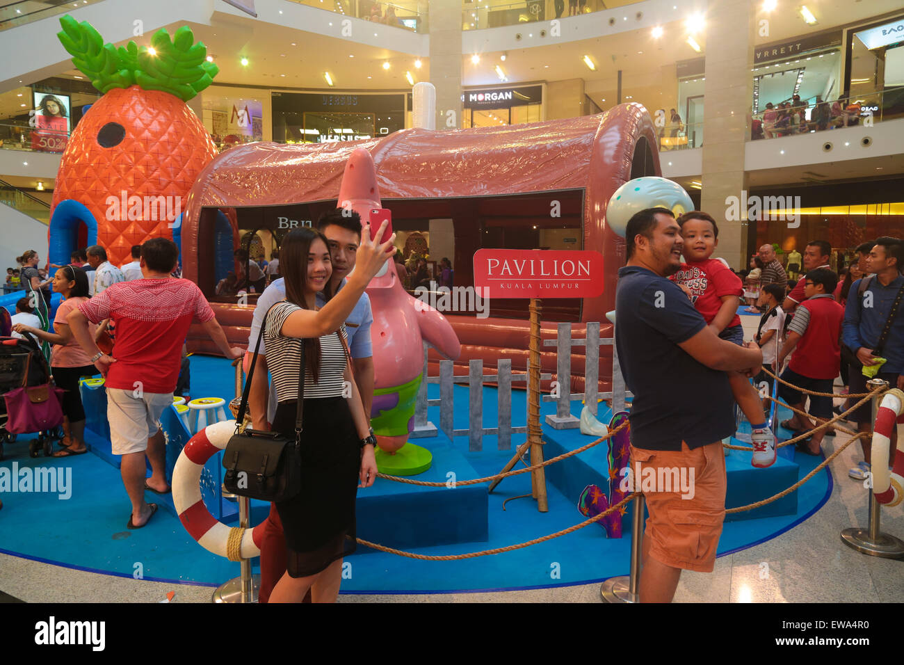 Couple visiting the Spongebob promotion activity at Pavillion Shopping ...