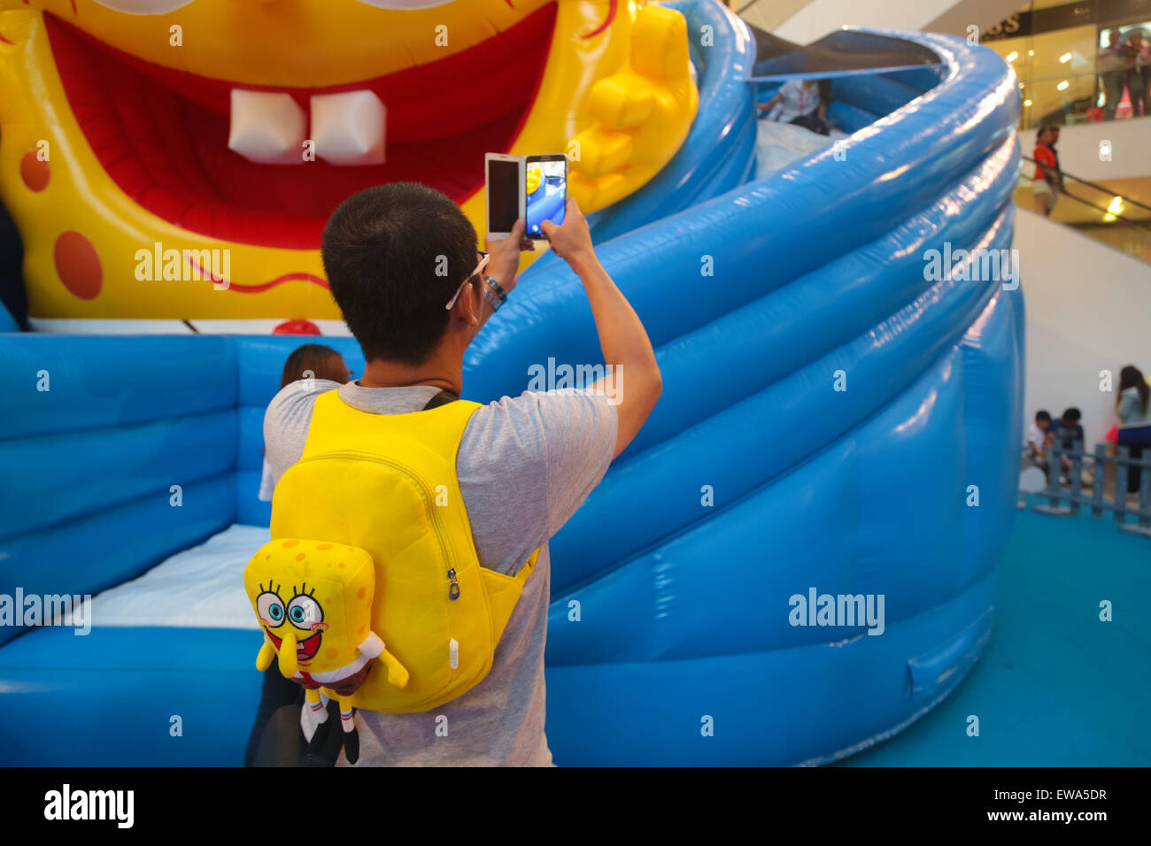 Father wearing spongebob backpack at the Spongebob promotion ground at ...