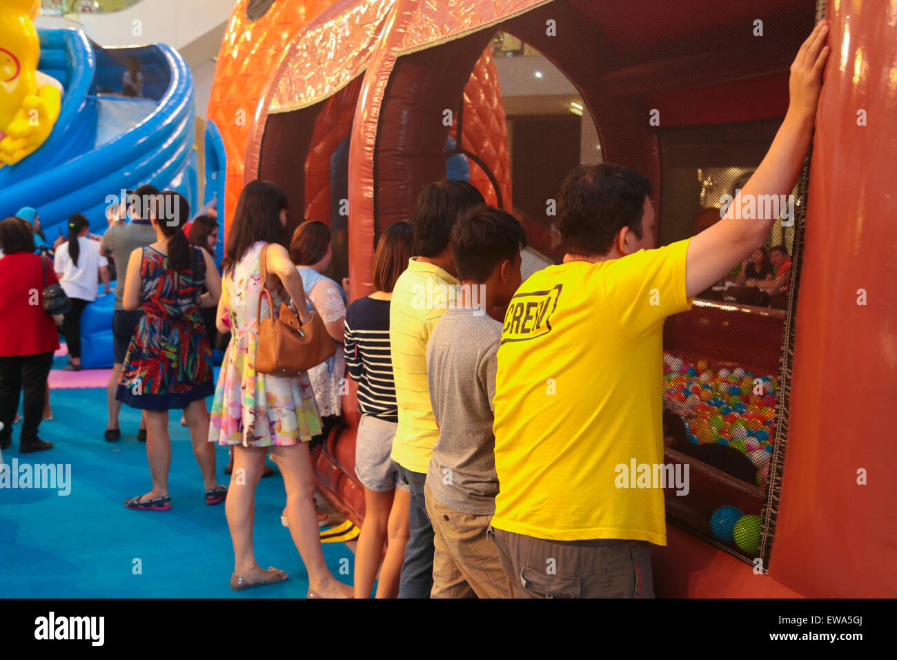 Parents watching the ball pit at the Spongebob promotion ground at ...