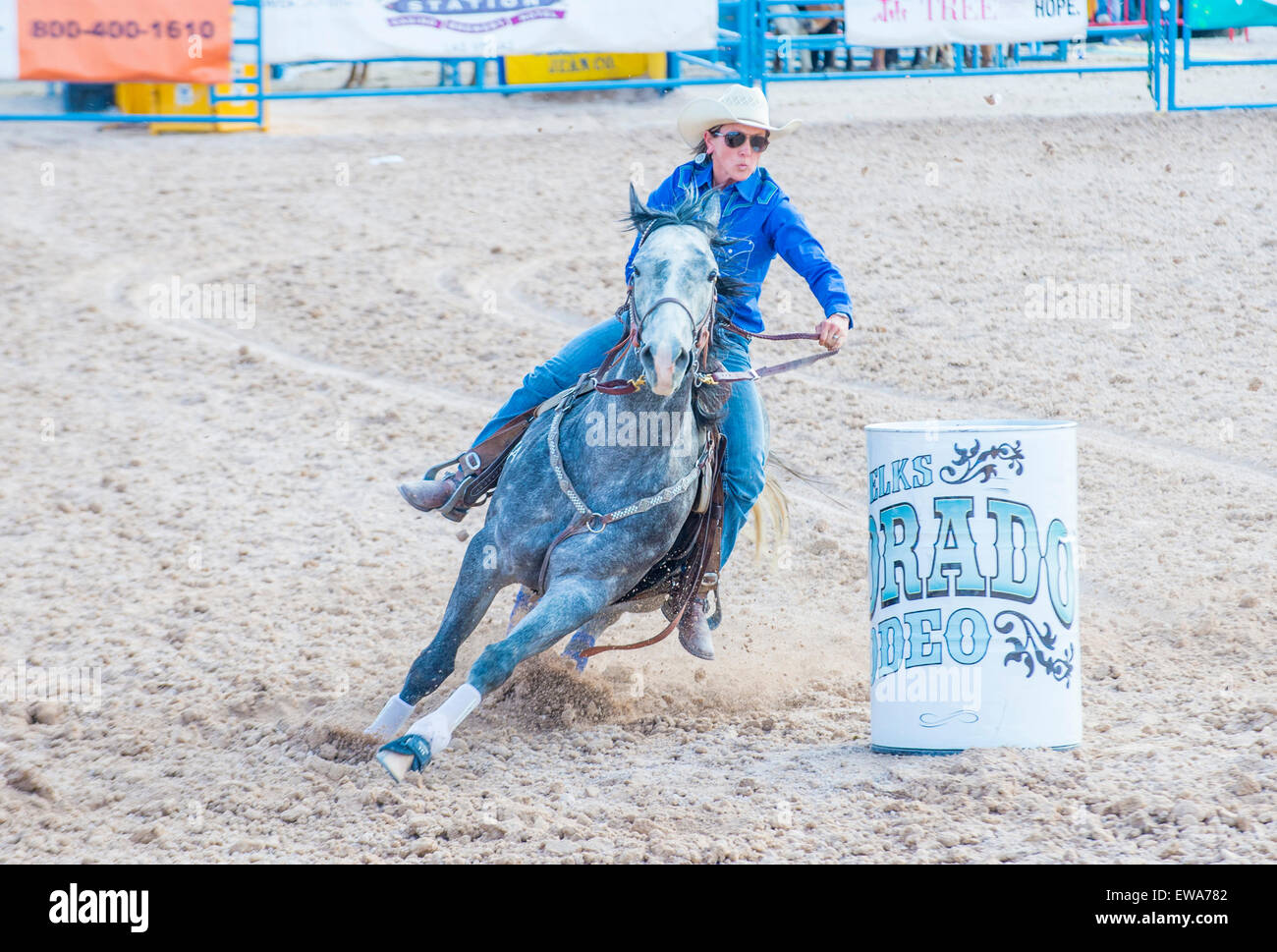 Cowgirl Participating in a Barrel racing competition at the Helldorado ...