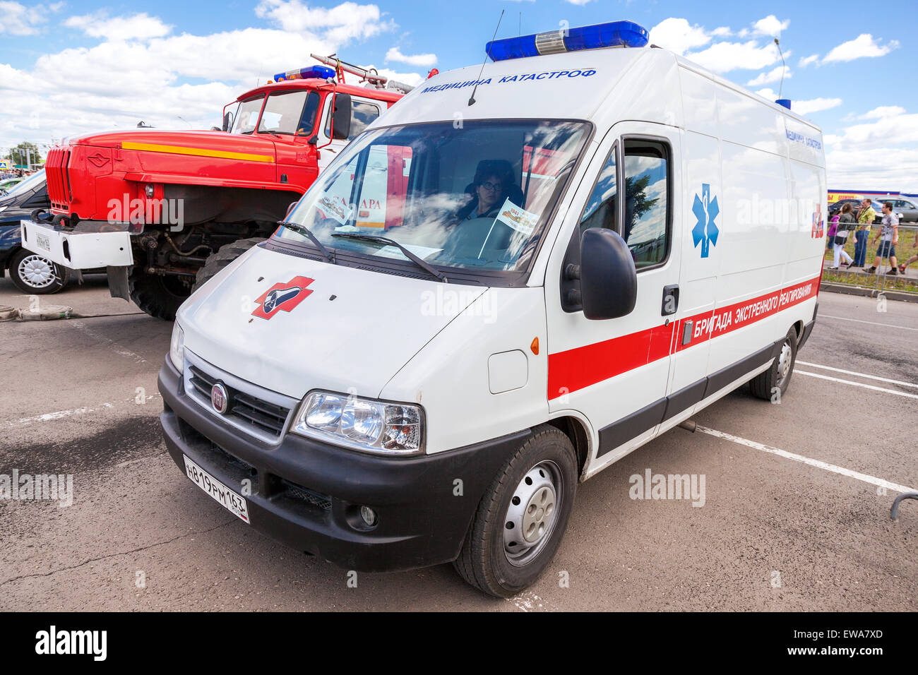 Ambulance car parked up in the street. Text on russian: "Team of ...
