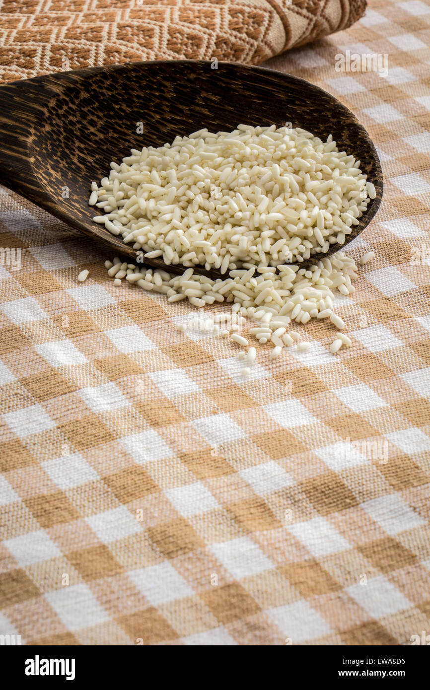 Wooden spoon, rice, cereals, cotton, texture, background Stock Photo ...