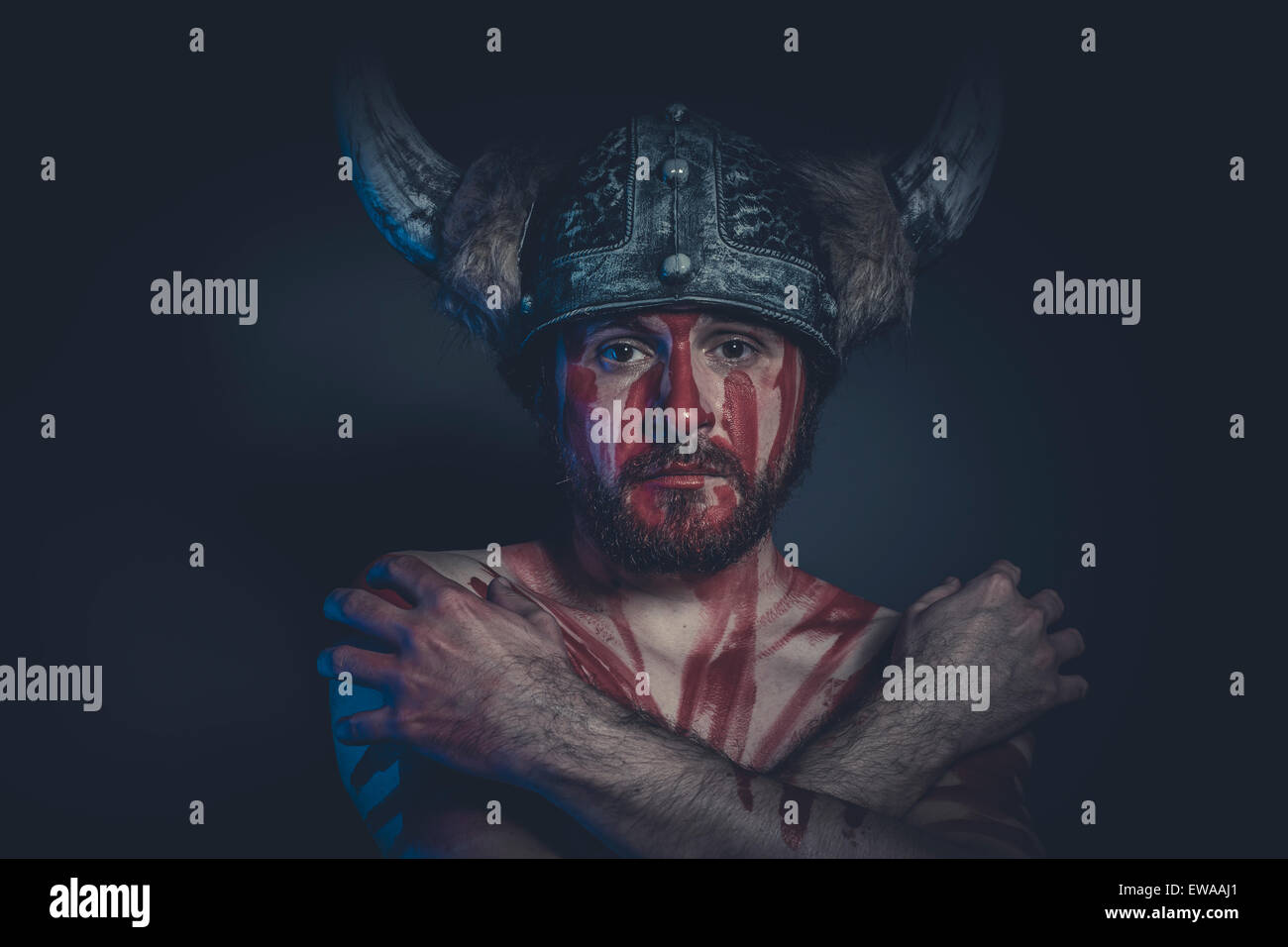 Fear, Viking warrior with a horned helmet and war paint on his face ...