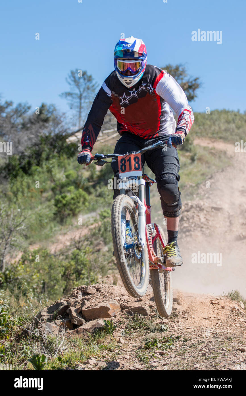 Downhill competition, Biker jumps fast in the countryside Stock Photo ...