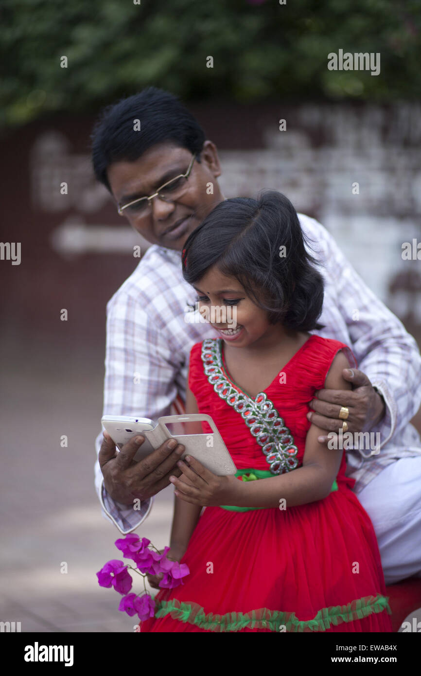 Dhaka, Bangladesh. 20th June, 2015. DHAKA, BANGLADESH 20th June : Father with his little ...